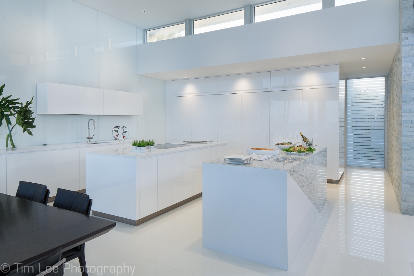 A Contemporary Resort-Inspired Home With A Kitchen Reflecting the Ocean